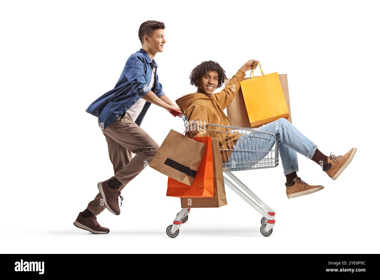 Guy running and pushing his friend seated inside a shopping cart ...