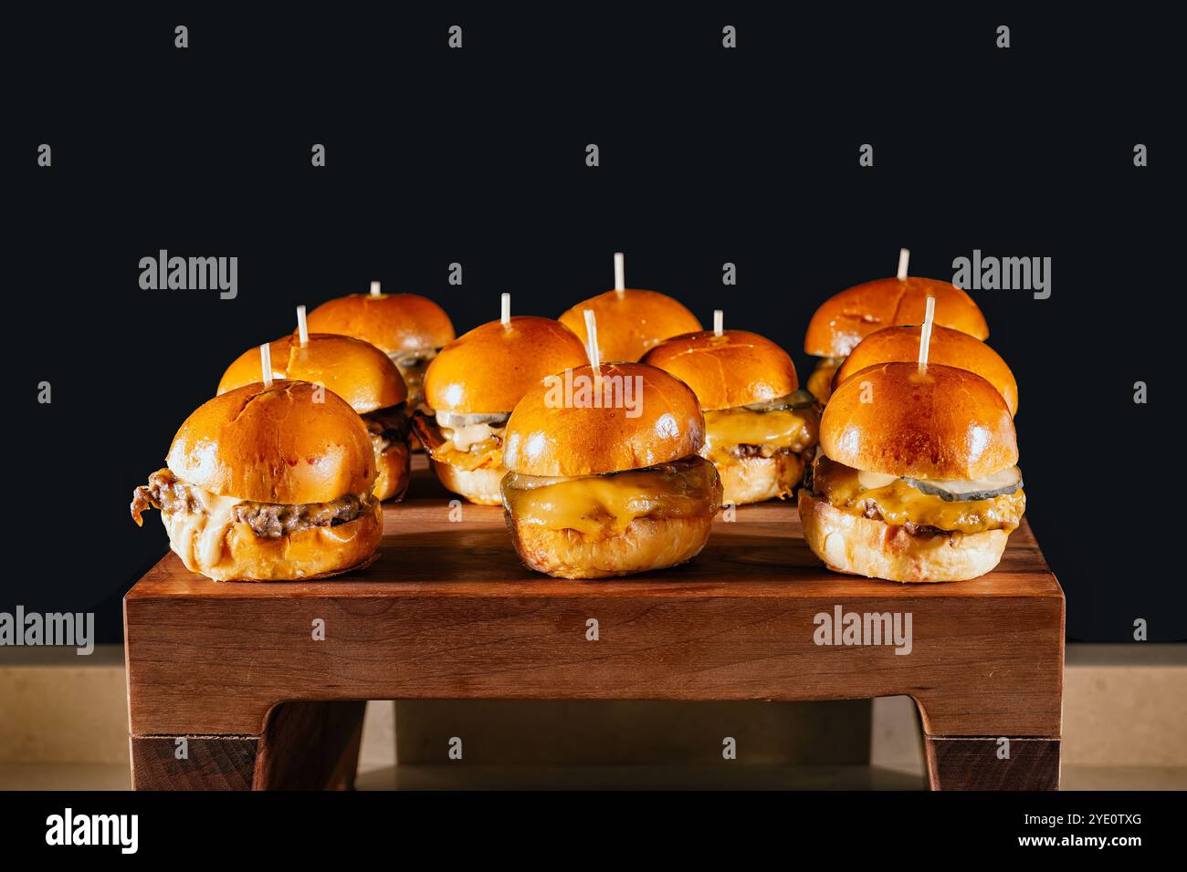 Beef and cheese sliders on a wood serving board Stock Photo - Alamy