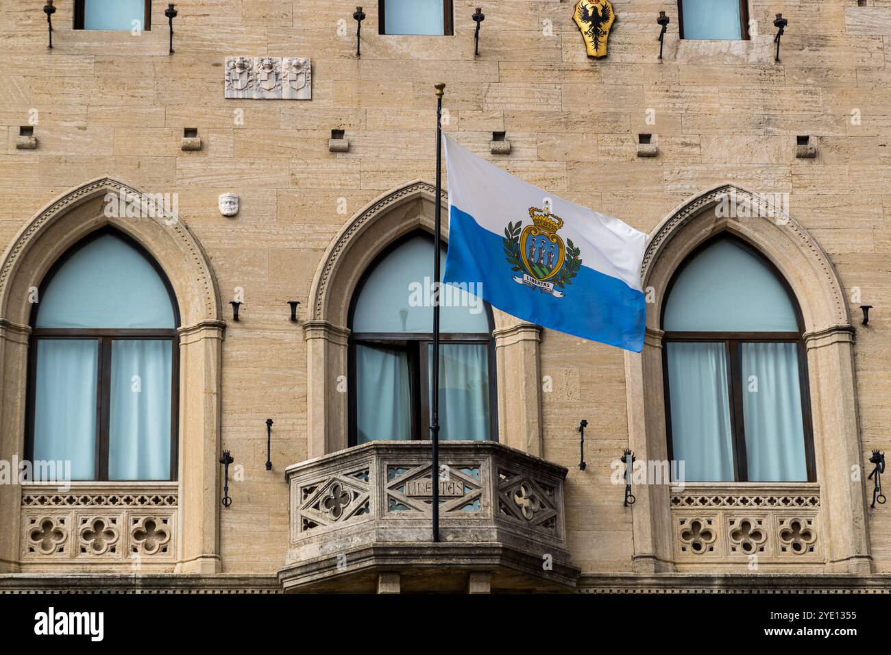 Hoisted flag in front of the Palazzo Publico in Piazza della Libertà ...