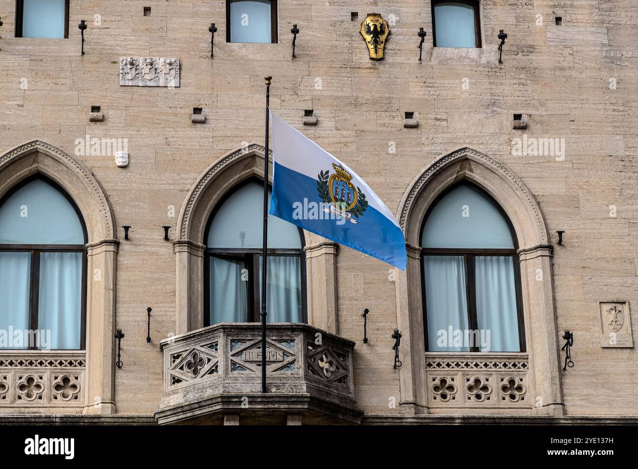 Hoisted flag in front of the Palazzo Publico in Piazza della Libertà ...