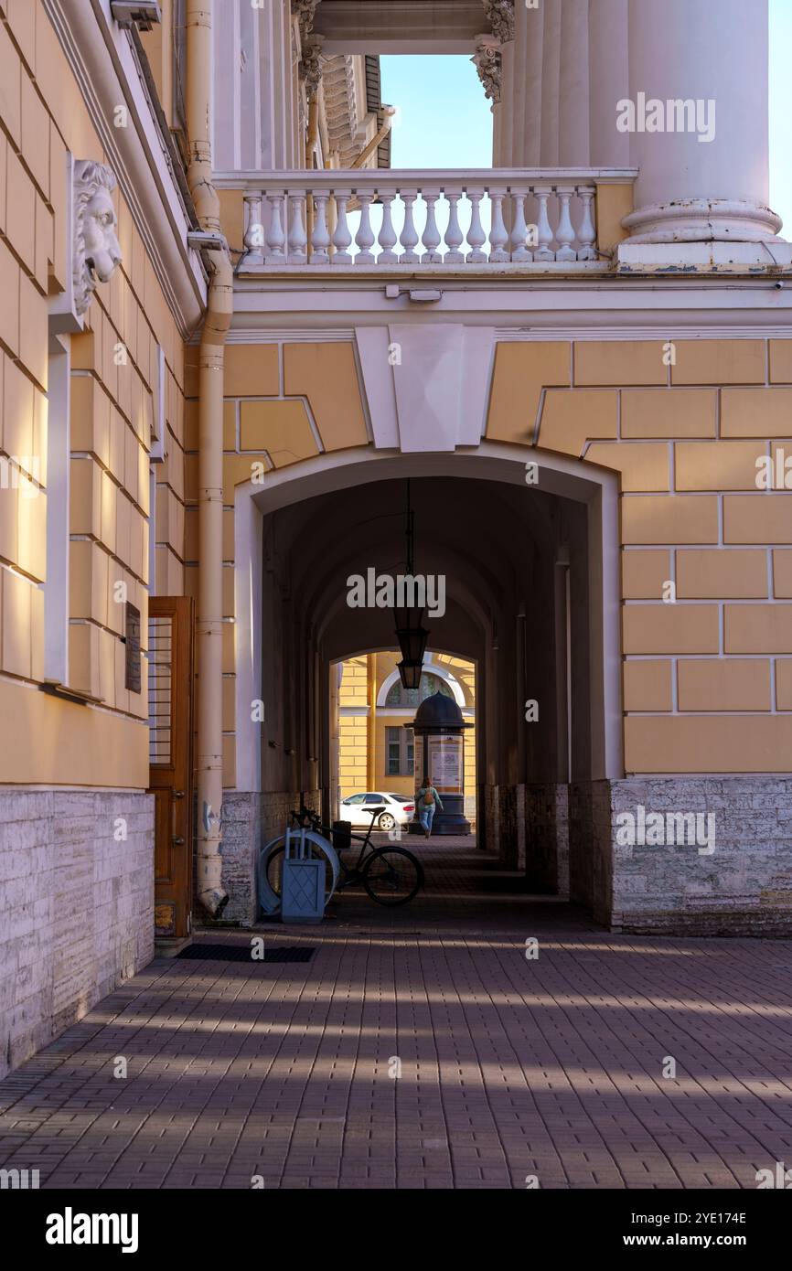 A covered passageway with an arched ceiling in a historic building ...