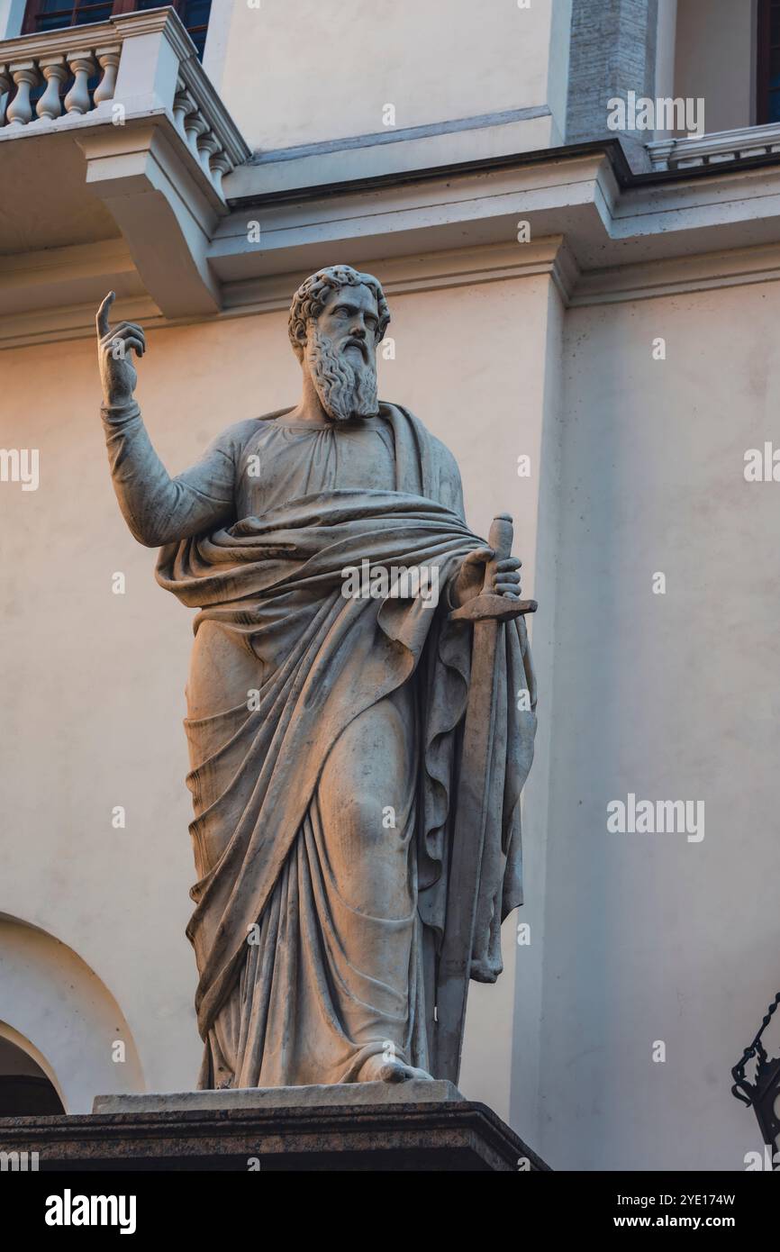 Close-up of a classical statue of a bearded man in robes on a historic ...