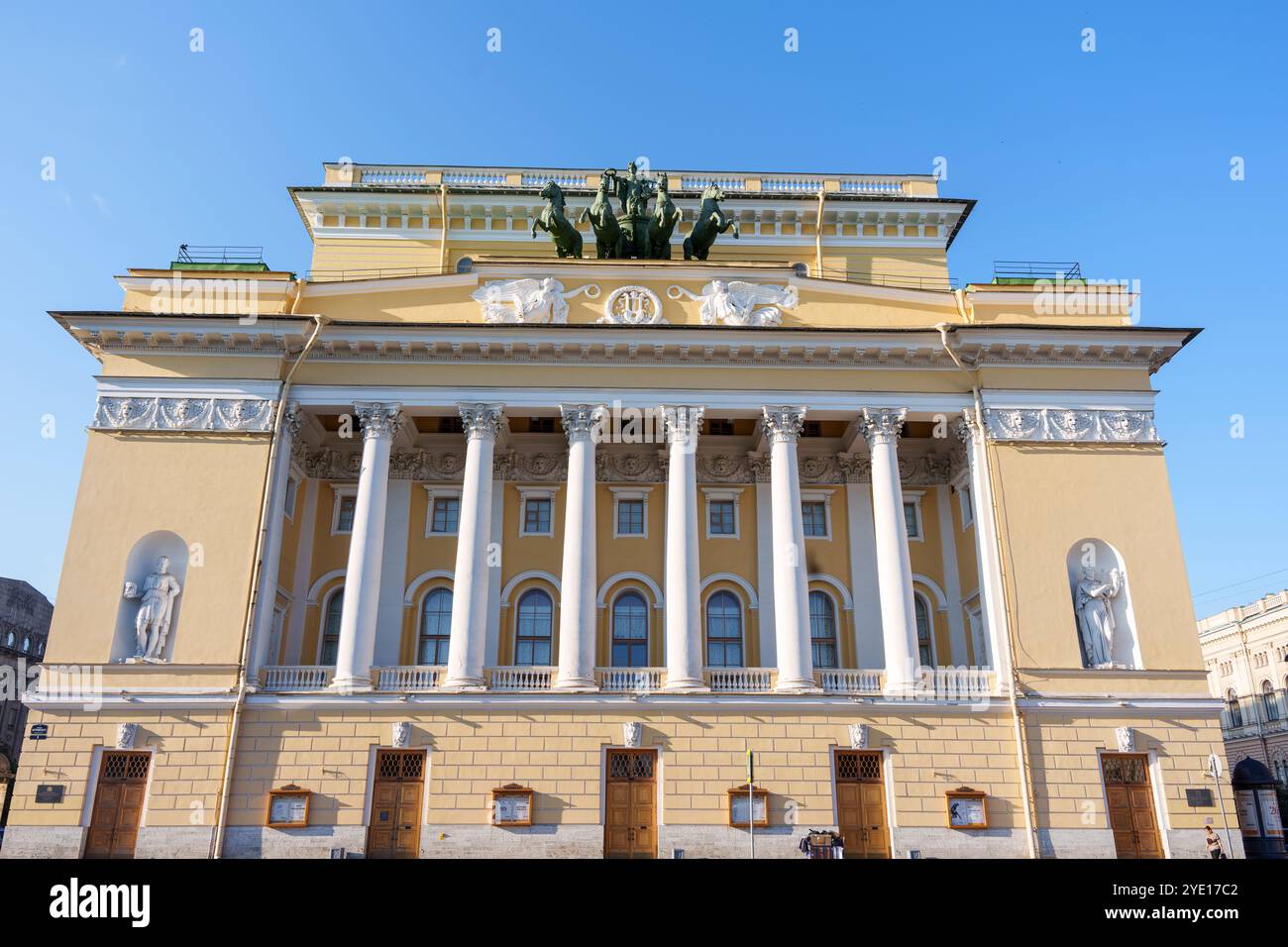 Front view of a neoclassical theater building with grand columns and a ...