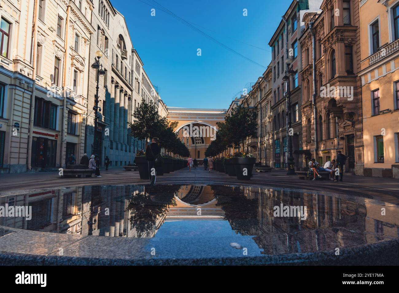 Reflection of historic archway and buildings in St. Petersburg street ...