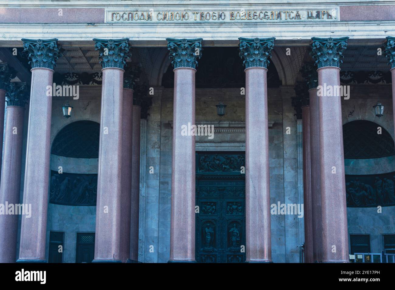 Grand entrance with towering columns and ornate bronze door Stock Photo ...