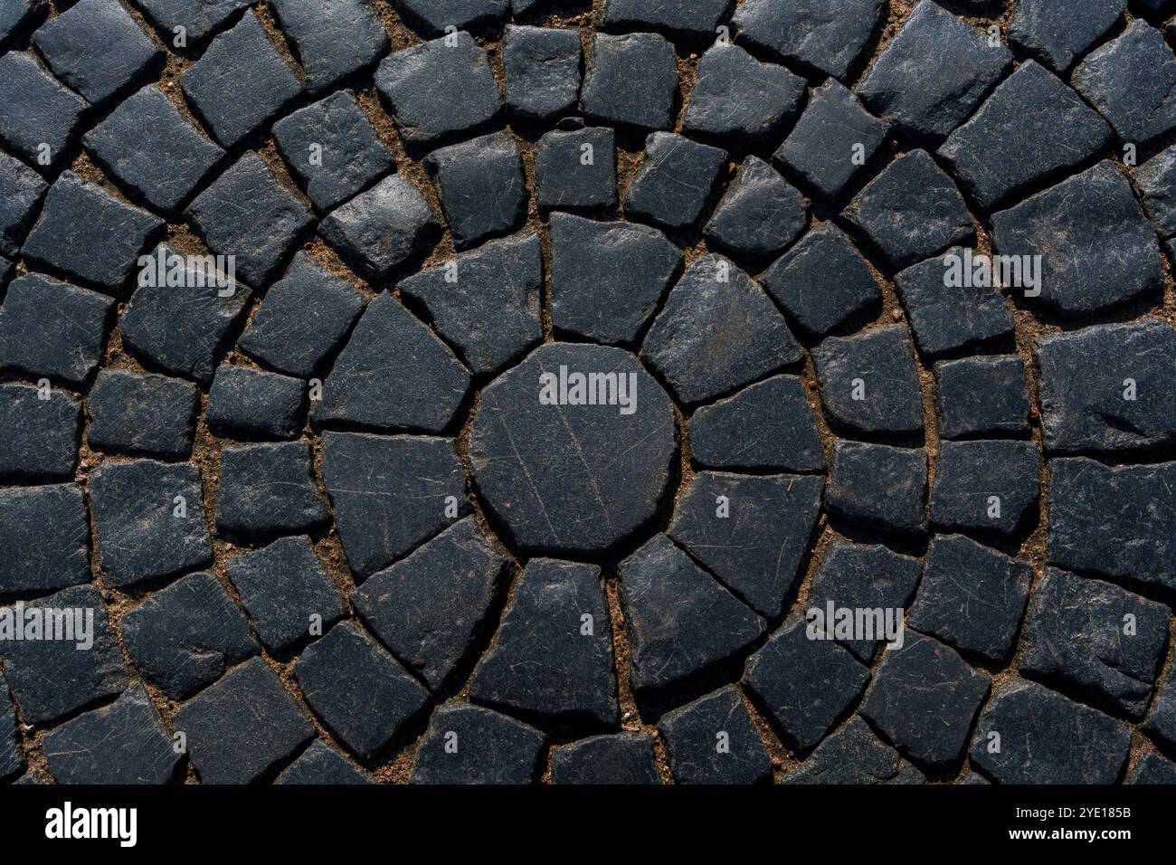 Circular stone cobblestone pattern on pavement Stock Photo - Alamy