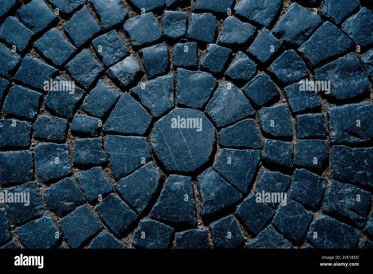 Circular stone cobblestone pattern on pavement Stock Photo - Alamy