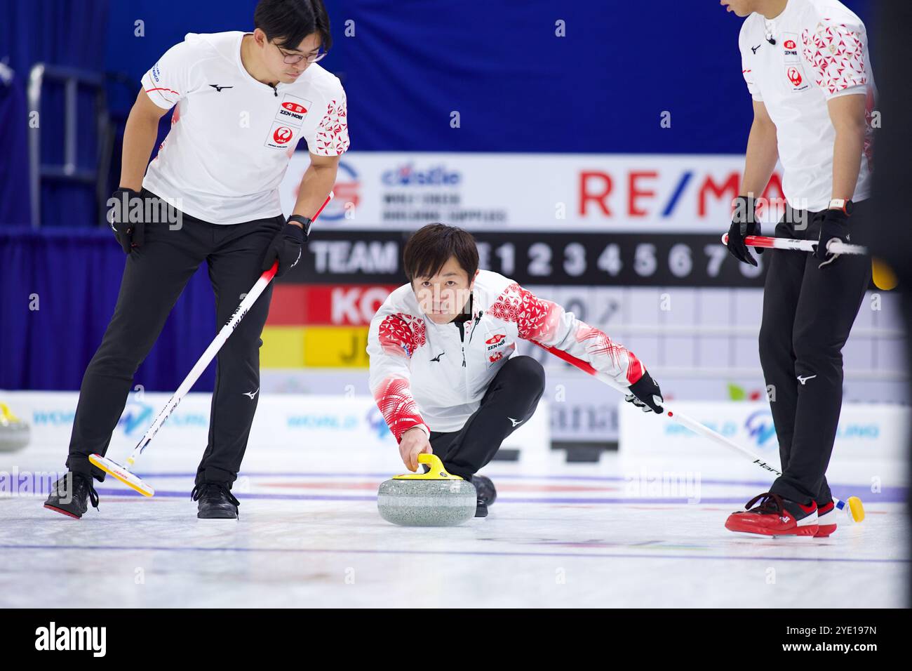 ABE Shinya throws a stone at the 2024 Pan Continental Curling Championship in Lacombe, Alberta ...