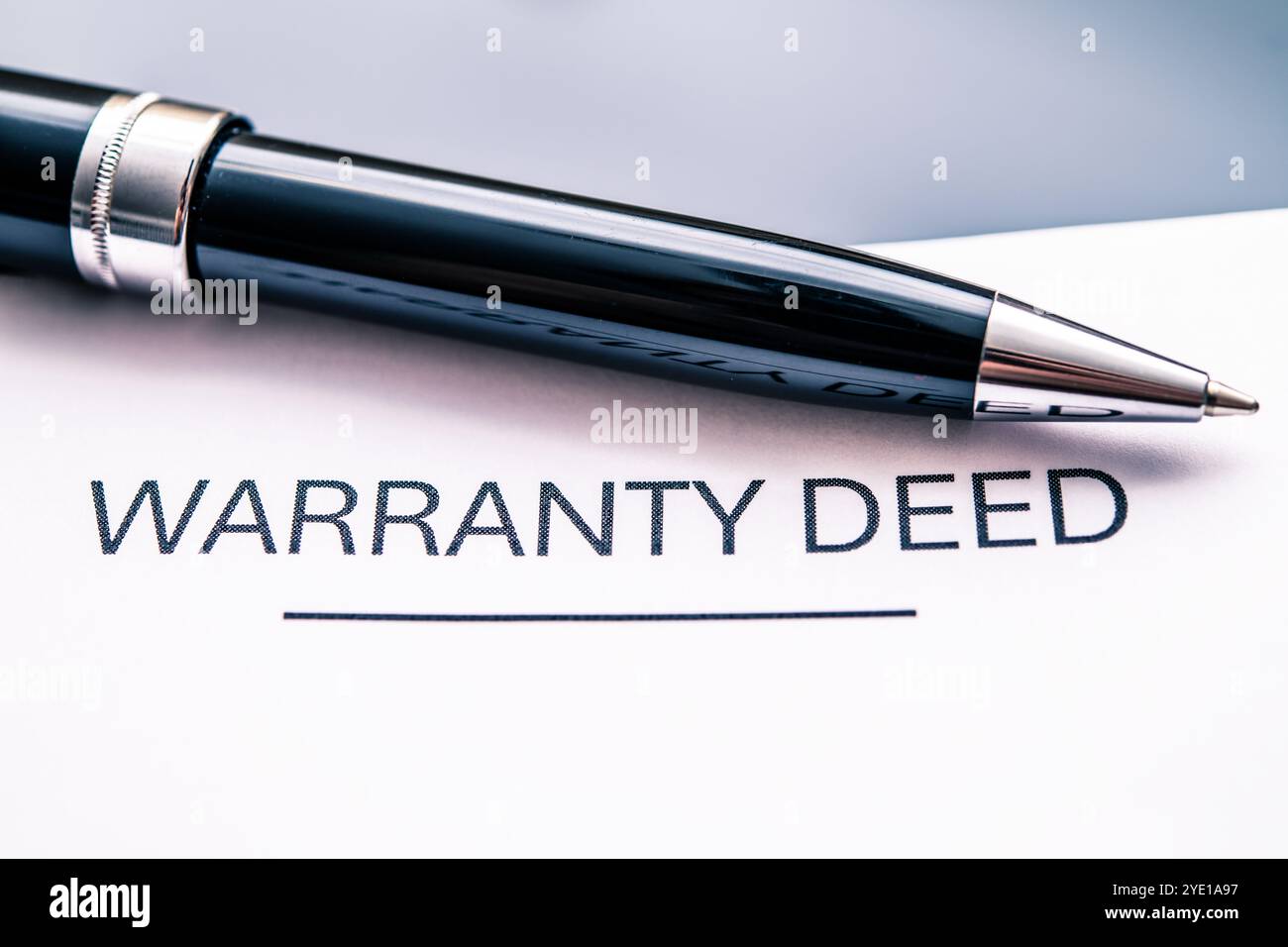 Close-up focus on a warranty deed showing essential elements of ...