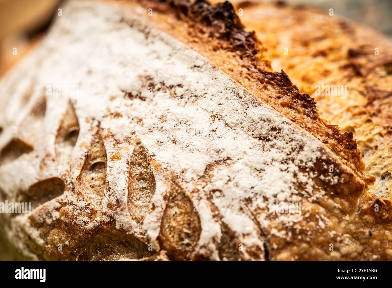 Close-up of artisanal sourdough bread showcasing its crispy crust ...