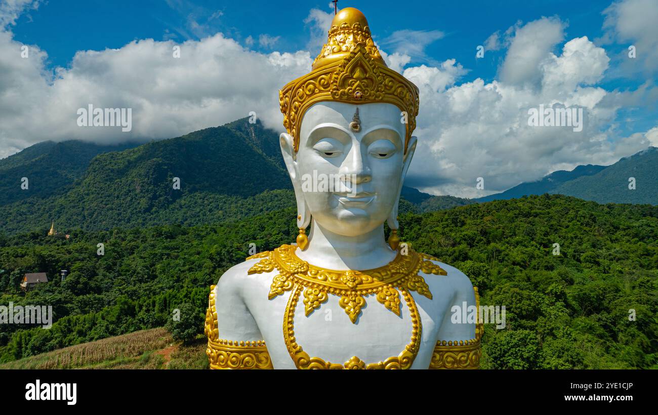 Close up the Tall Buddha Brahma Panyo statue standing tall in front of ...