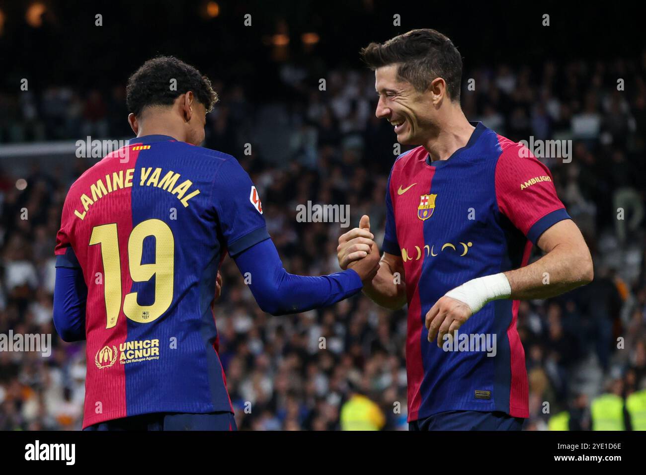 Madrid, Spain. 26th Oct, 2024. Robert Lewandoski and Lamine Yamal of FC ...