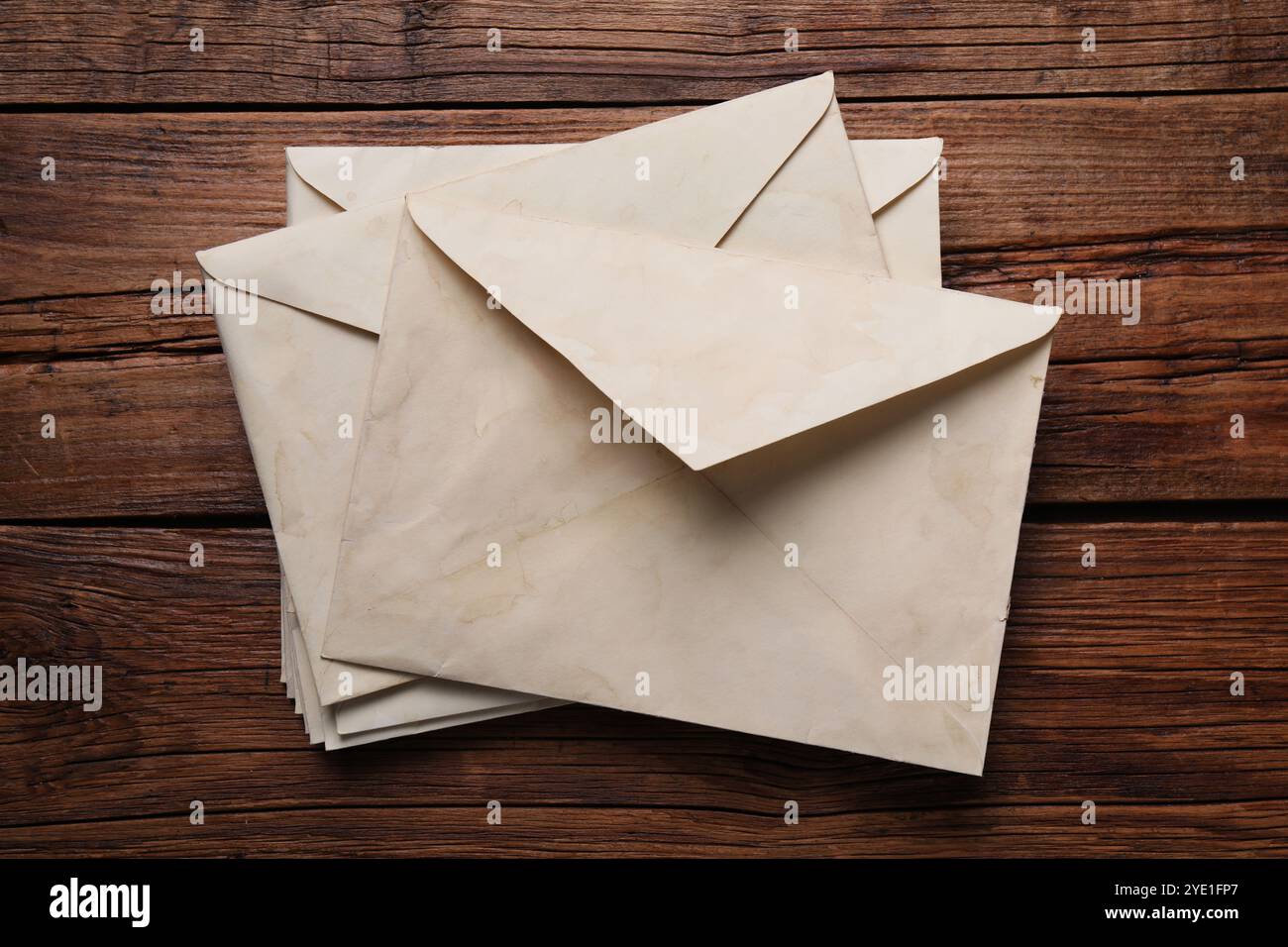 Old letter envelopes on wooden table, top view Stock Photo - Alamy