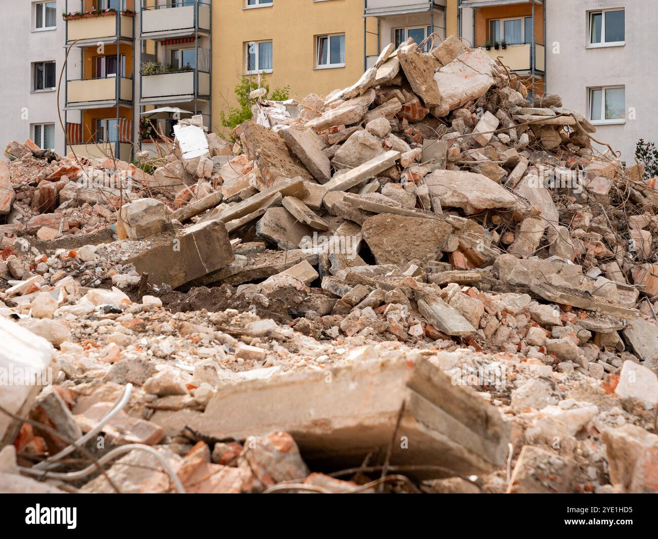 Demolition rubble in front of a residential building. The houses at the ...