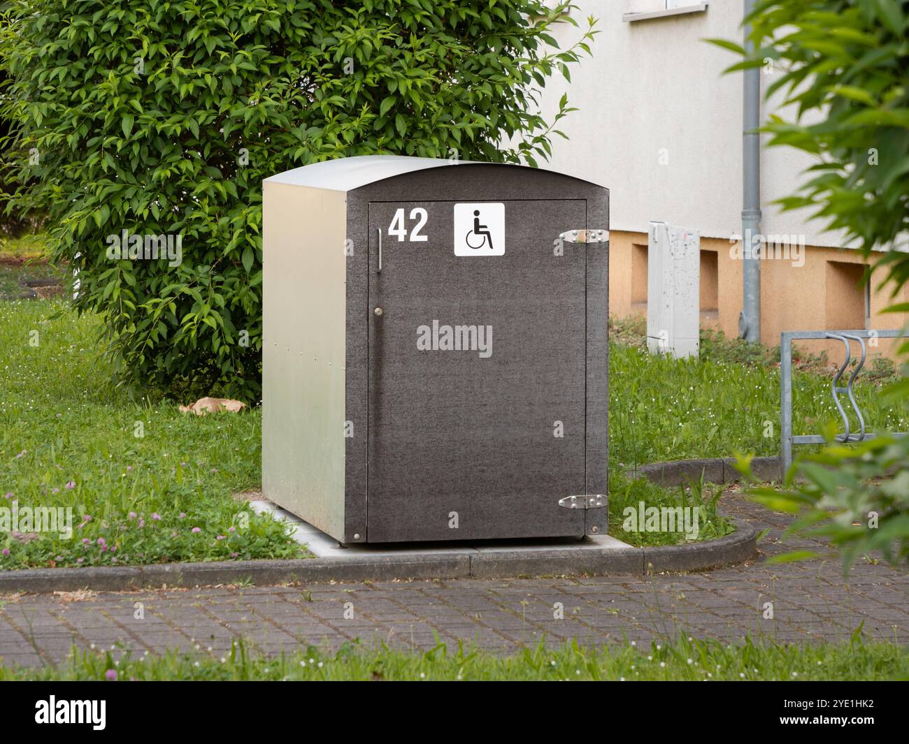 Walker box in front of a house entrance. Garage for a wheelchair or a ...