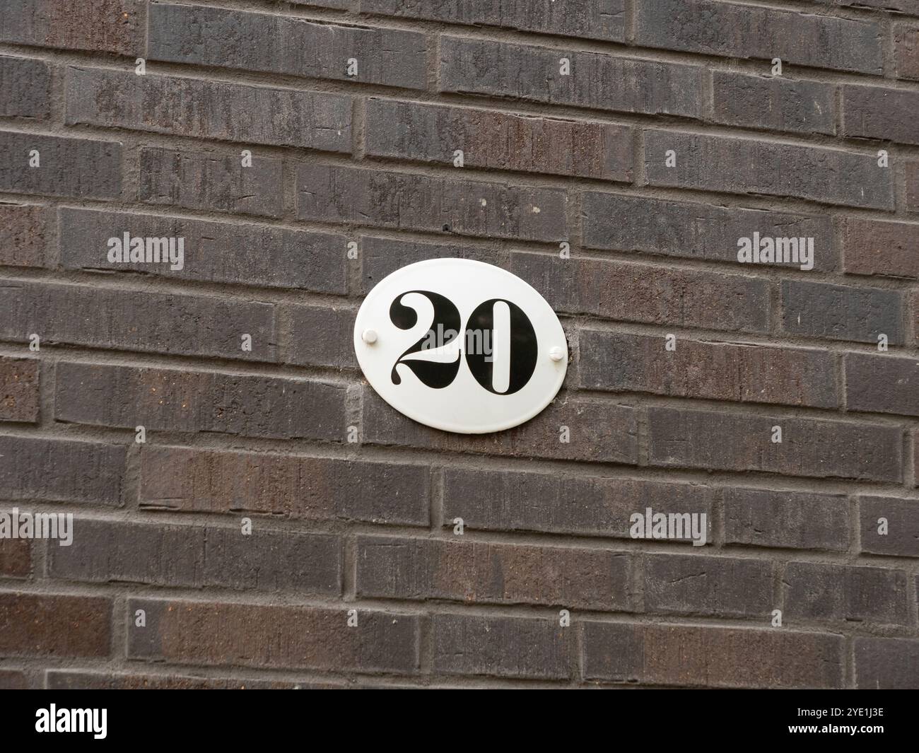 Number 20 on an exterior house wall. The twenty is part of an address ...