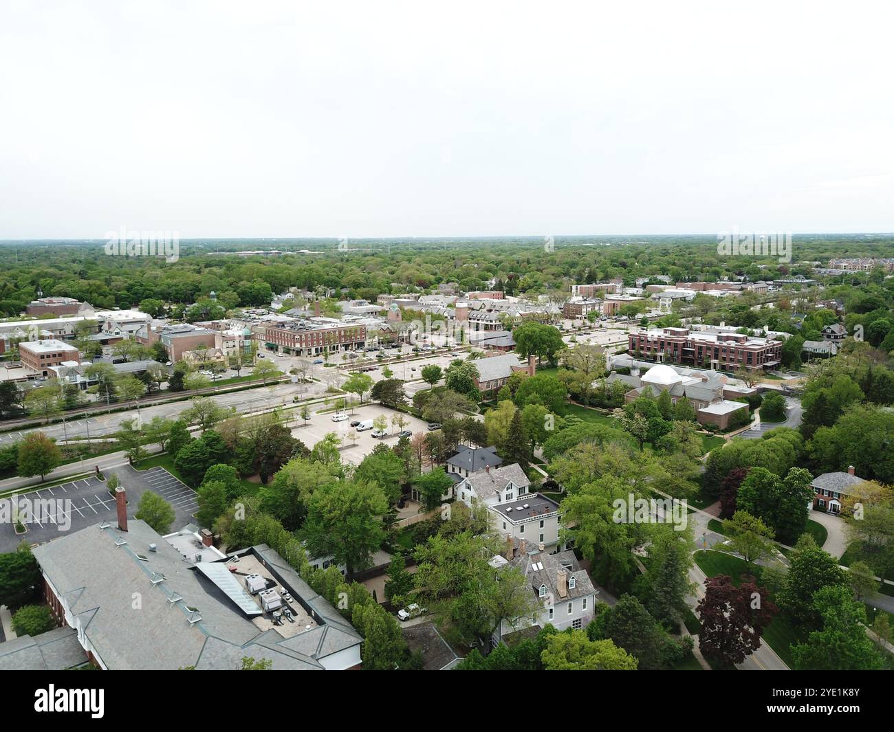 A peaceful aerial view of a charming small town surrounded by lush ...