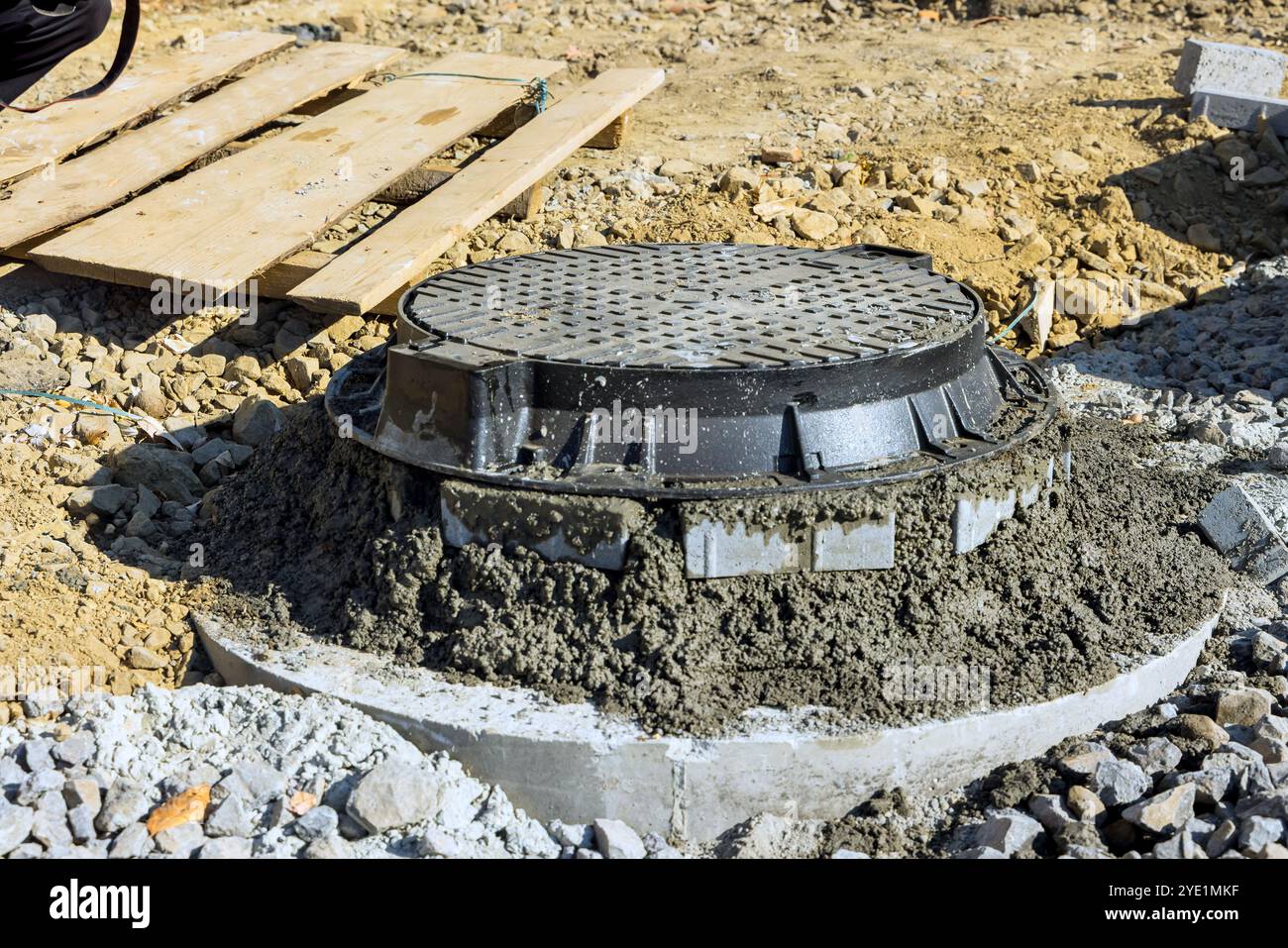 Concrete is being applied to stabilize blocks forming upper edge of ...
