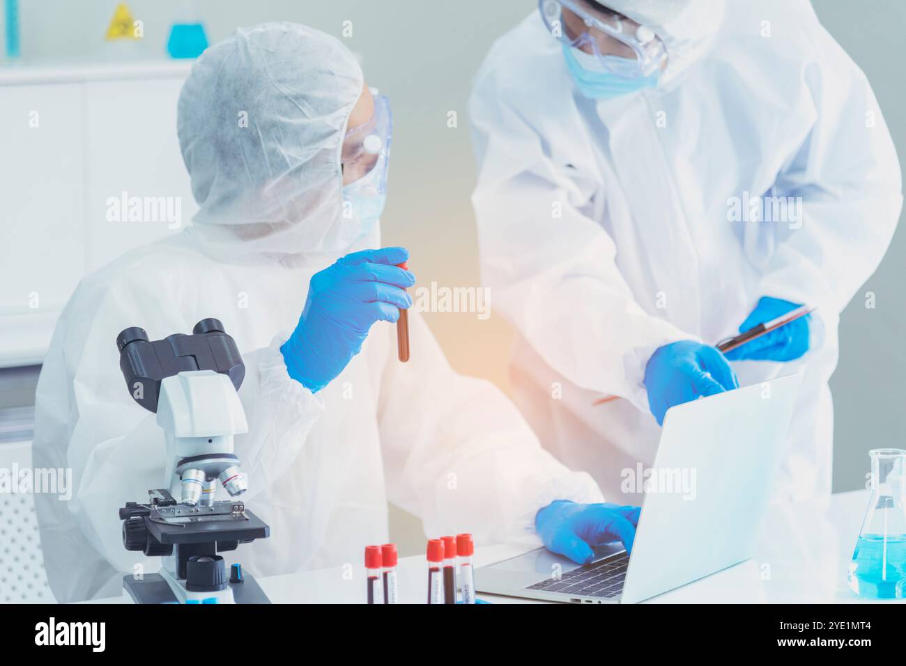 Male Scientist look into Microscope research in science laboratory ...