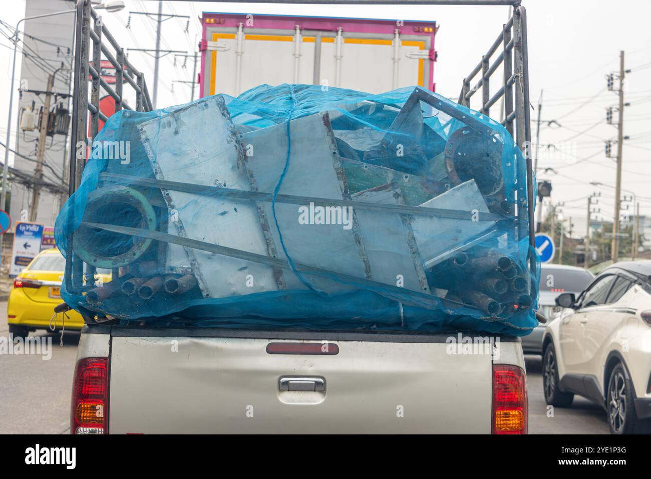 The pick-up car full loaded of an old used construction material ride ...