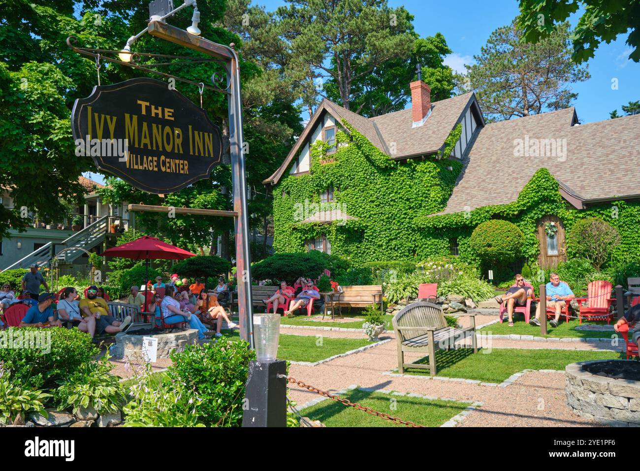 Tourists, guests enjoying the front courtyard of the iconic, relaxing ...