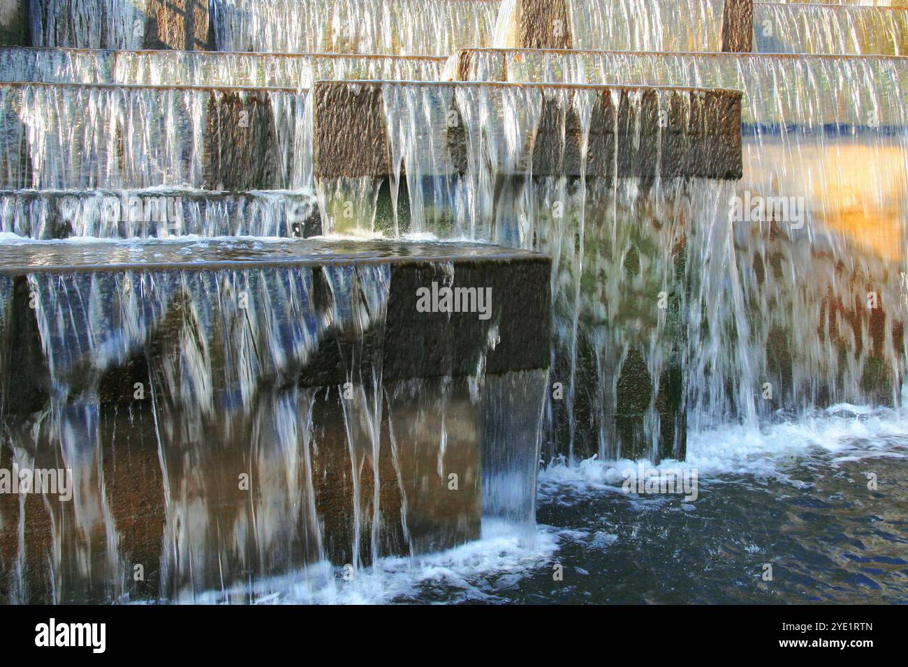 Decorative waterfall on the dam. ..Flowing water on a reservoir dam ...