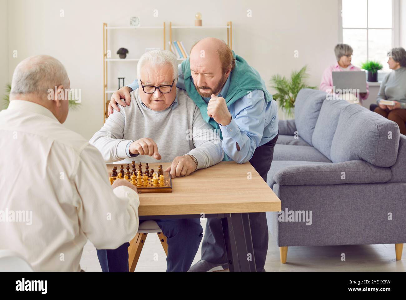 Cheerful elderly men playing chess hi-res stock photography and images ...