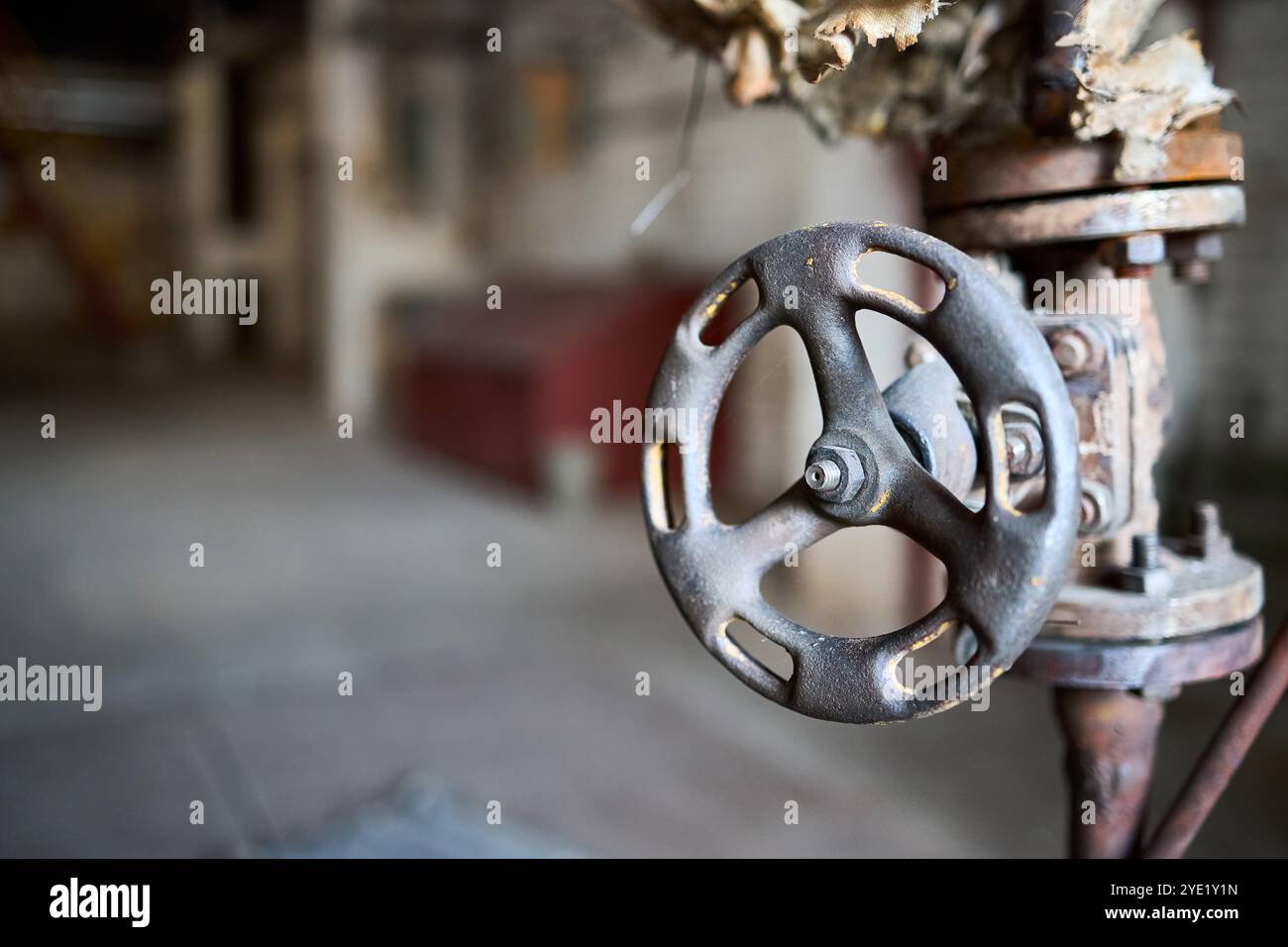 Industrial dusty chemical petrochemical retro style valve closeup with ...