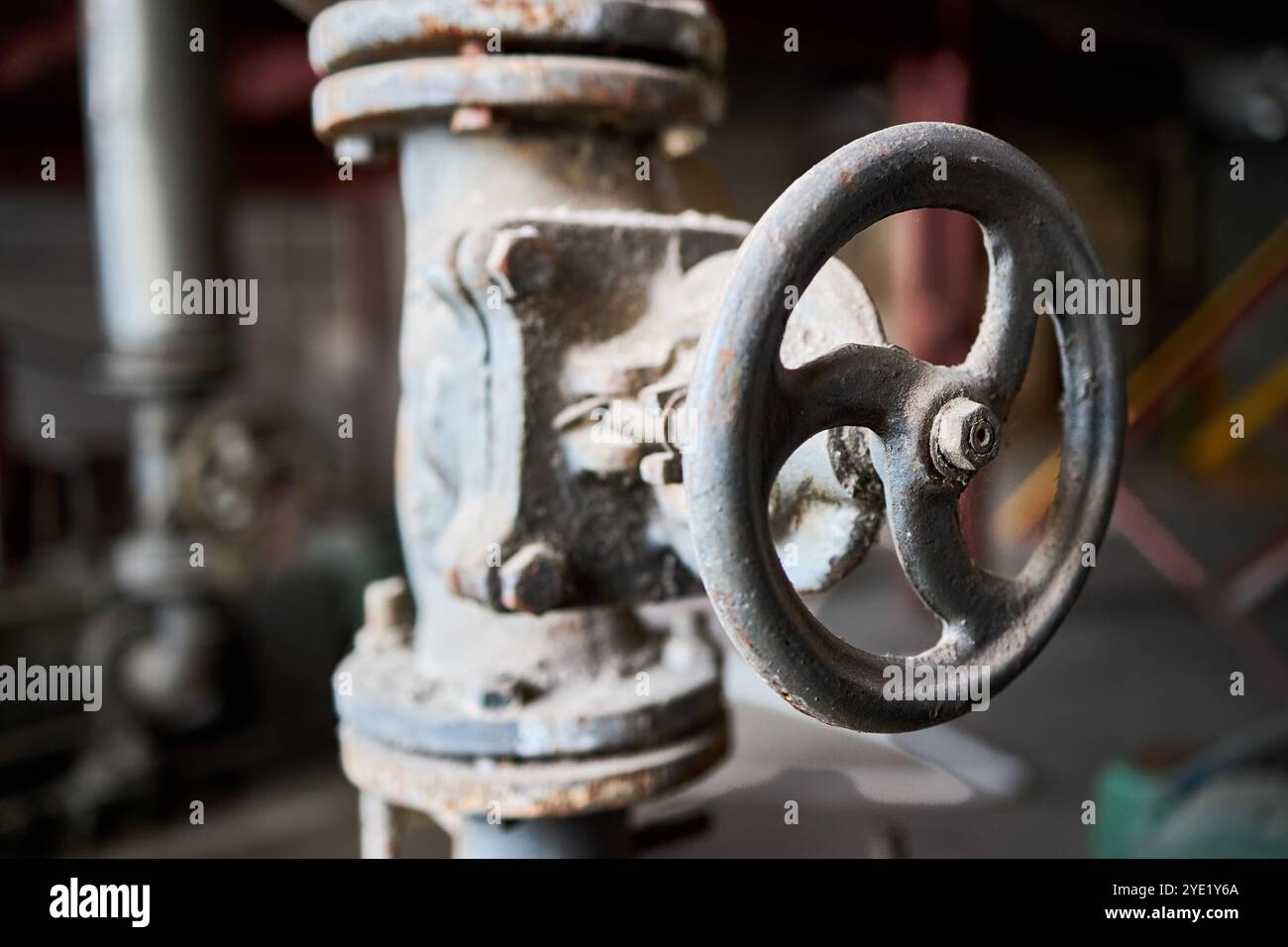 Industrial dusty chemical petrochemical retro style valve closeup with ...