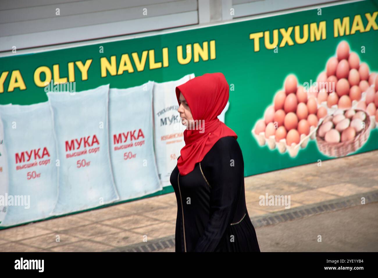 Tashkent,Uzbekistan;September,16,2024:a Muslim woman wearing a red ...