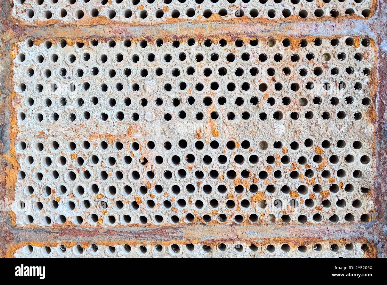 Tube sheet or plate of heat exchanger boiler closeup selective focus ...