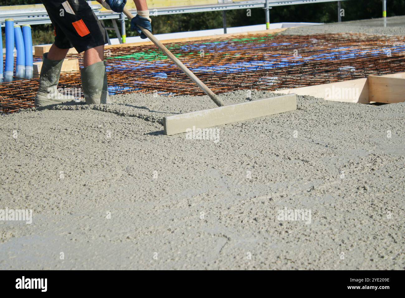 Workers filling the second floor ground with concrete, core and shell ...
