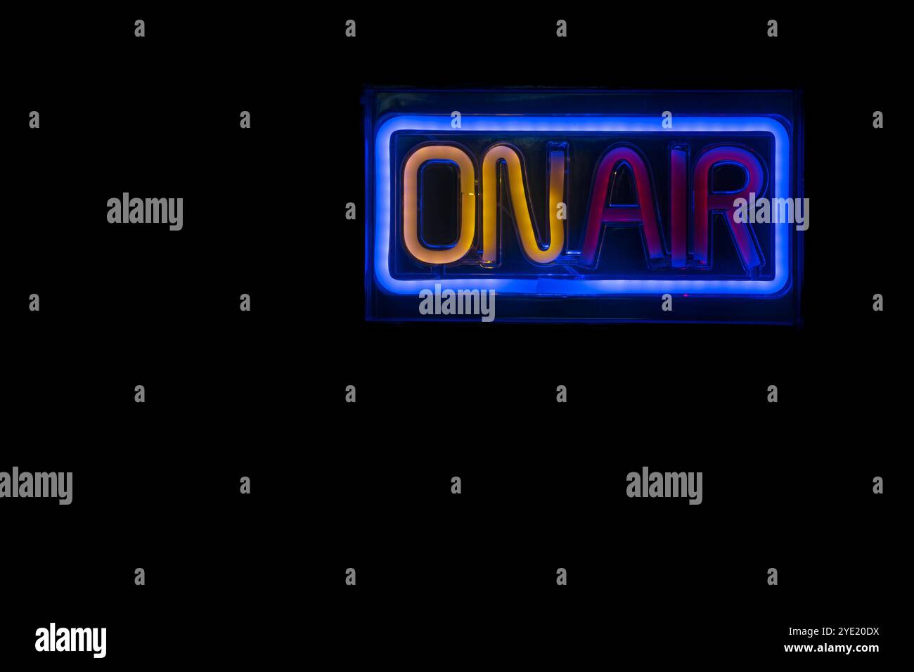 "On Air" Neon Signage: Bold Yellow and Purple-Red Glow Against Dark ...