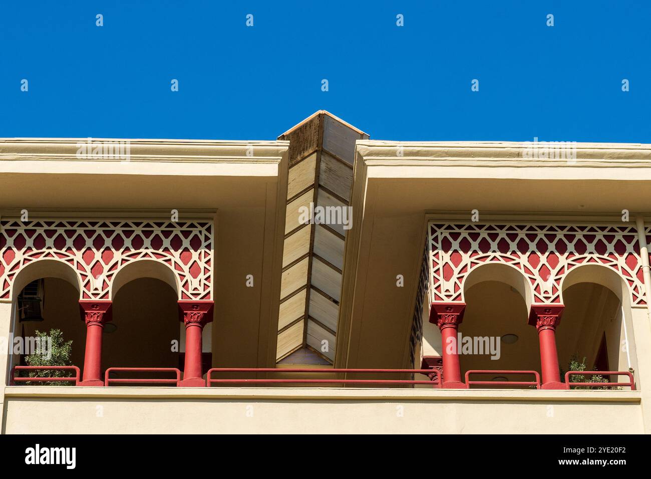 Vibrant Architecture with Red Pillars and Colorful Arch Frames on a ...