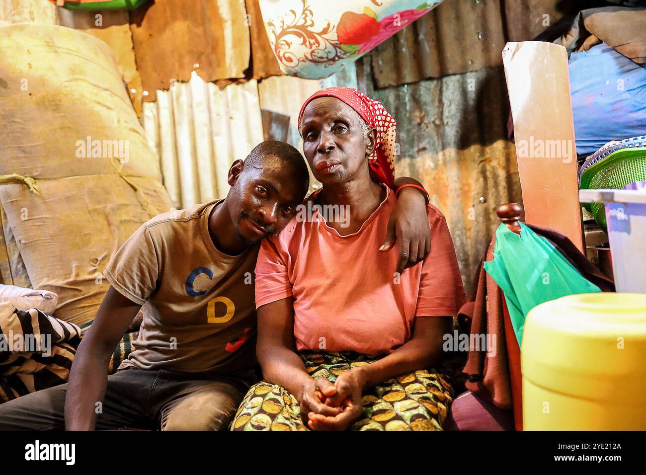 Nairobi, Kenya. 1st Oct, 2024. 28-Year-Old Joseph Macharia is seated together with his mother ...