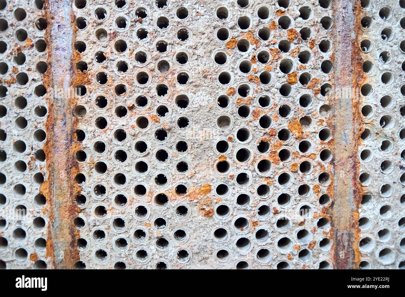 Tube sheet or plate of heat exchanger boiler closeup selective focus ...