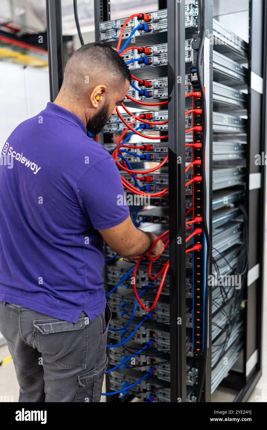Illustration of a worker preparing cables to connect to data centers in ...
