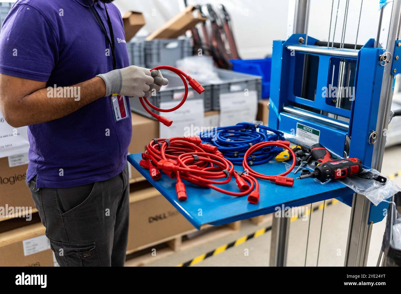 Illustration of a worker preparing cables to connect to data centers in ...