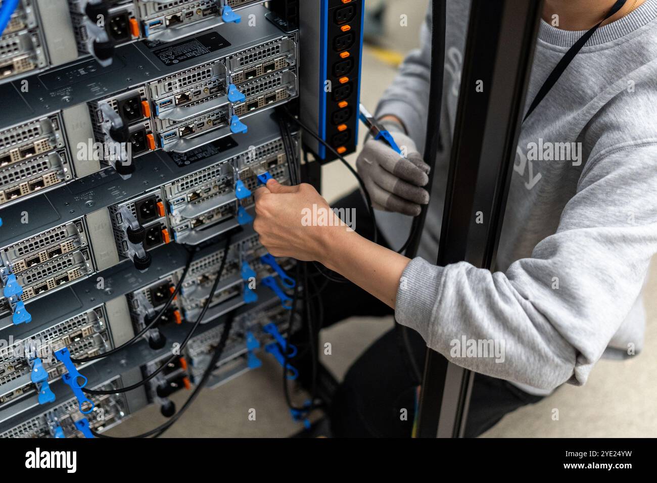 Illustration of a worker preparing cables to connect to data centers in ...