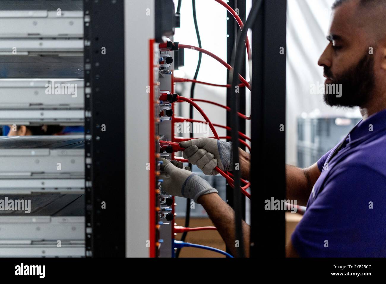 Illustration of a worker preparing cables to connect to data centers in ...