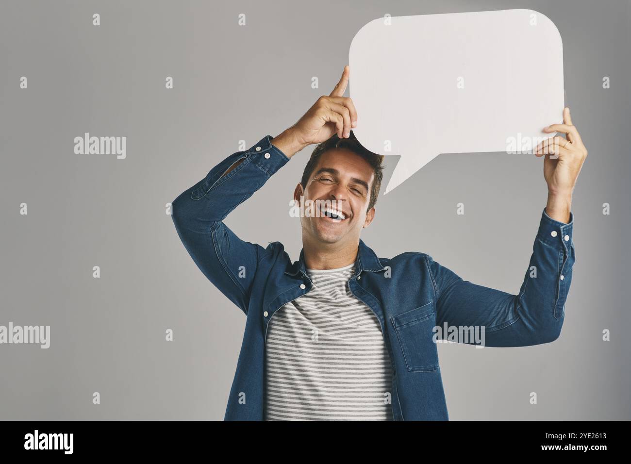 Speech bubble, man and communication with poster, funny and guy on gray ...