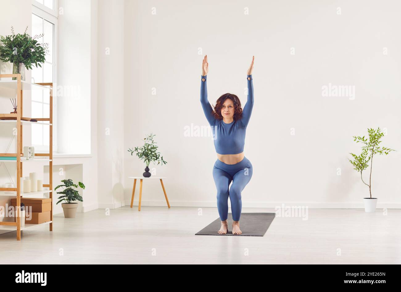 Beautiful yogi young woman wearing sportswear practicing yoga, doing ...