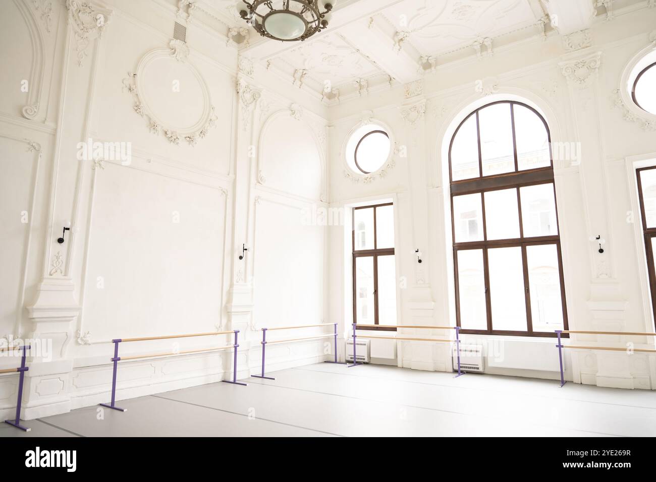Studio with white walls and open space for ballet and yoga classes ...