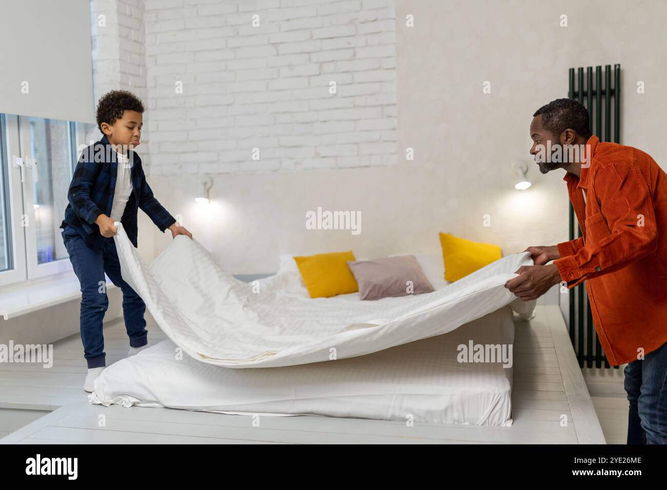 Kids making bed hi-res stock photography and images - Alamy