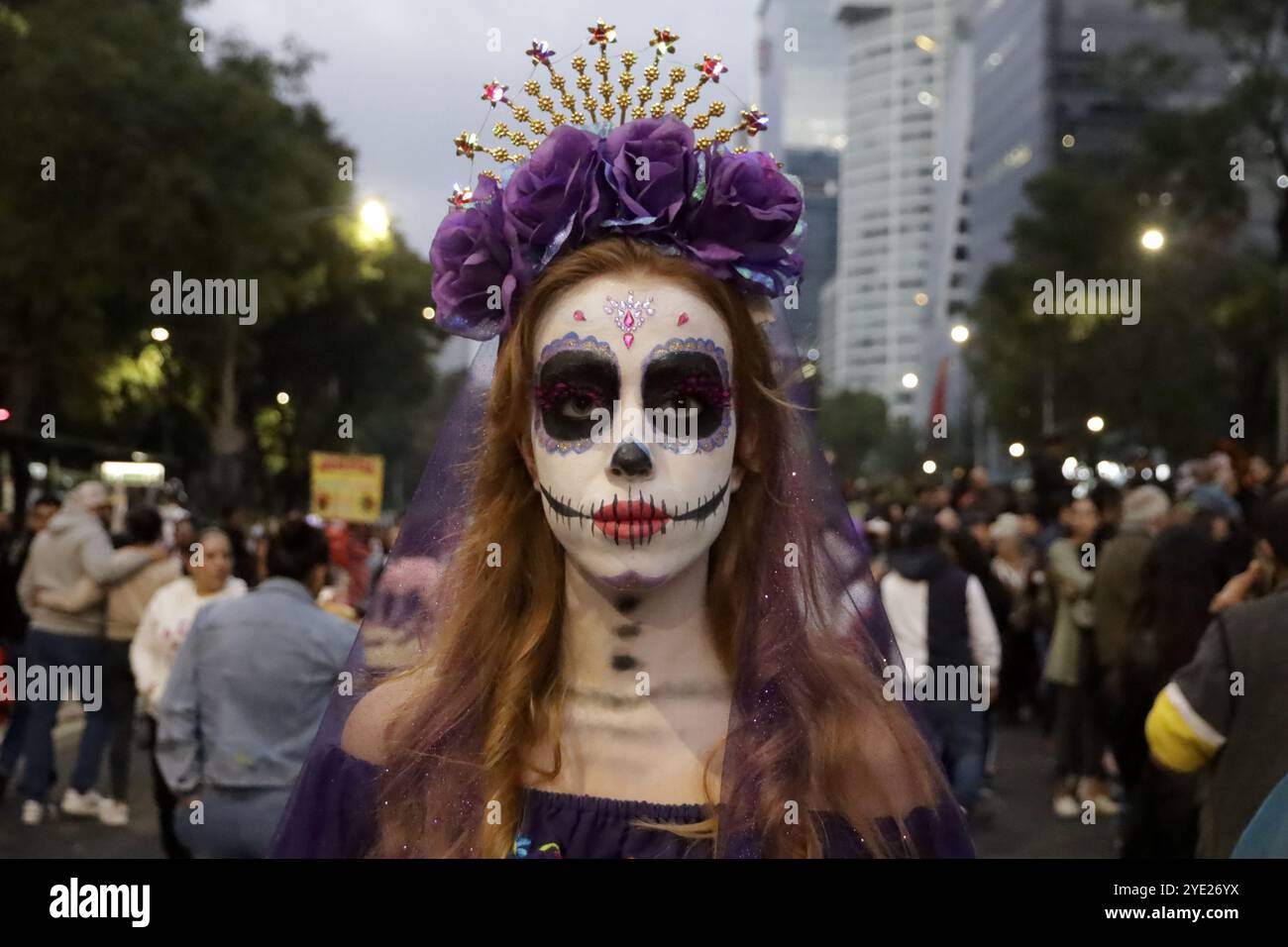 Non Exclusive: A woman dressed as catrinas with her face made up as ...