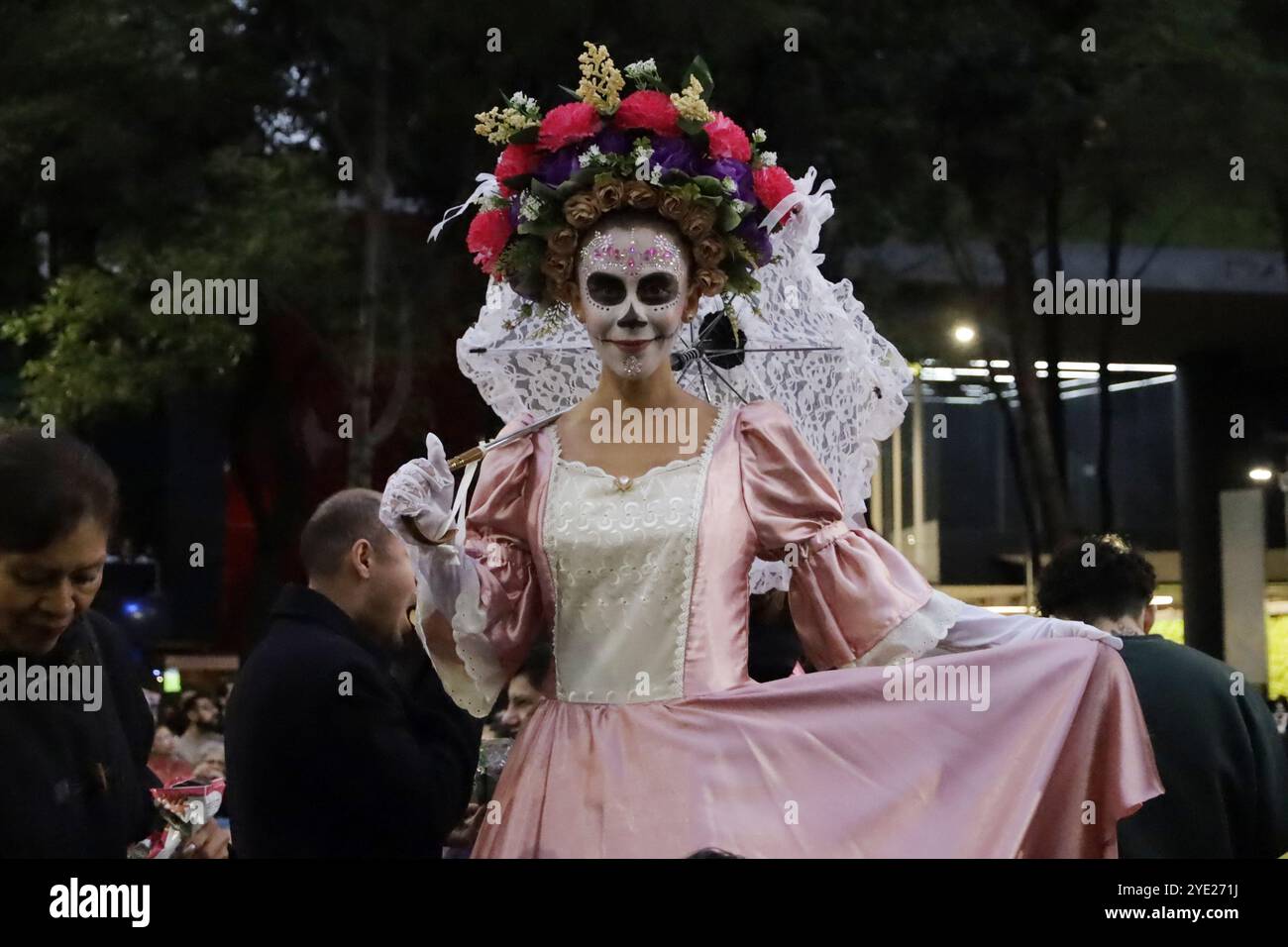 Non Exclusive: A woman dressed as catrinas with her face made up as ...