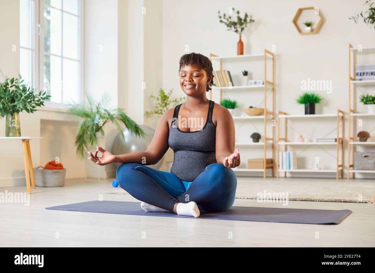 Sporty yogi fit middle aged happy african american woman peaceful ...