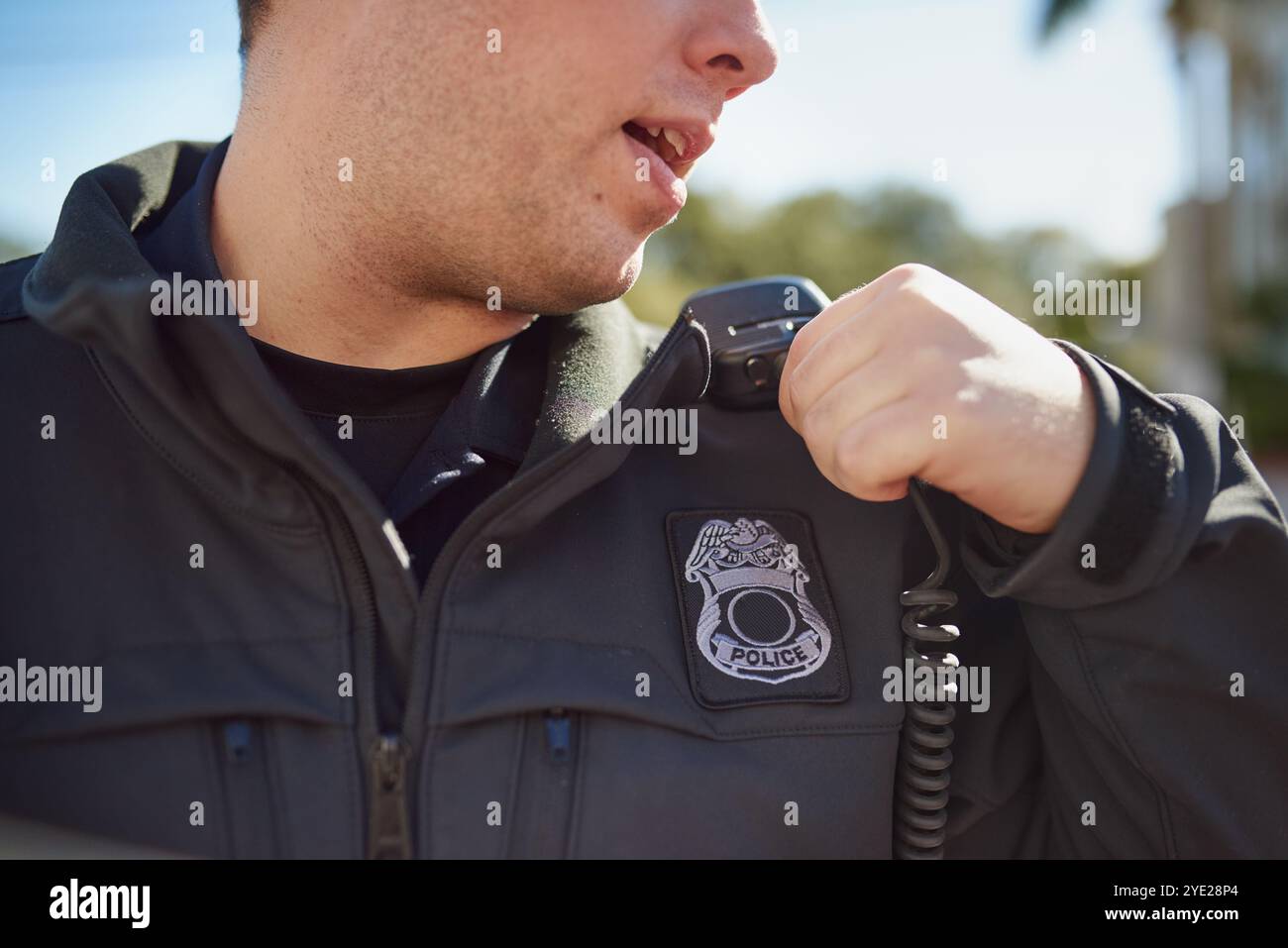 Man, mouth and police officer in city with radio, communication and ...