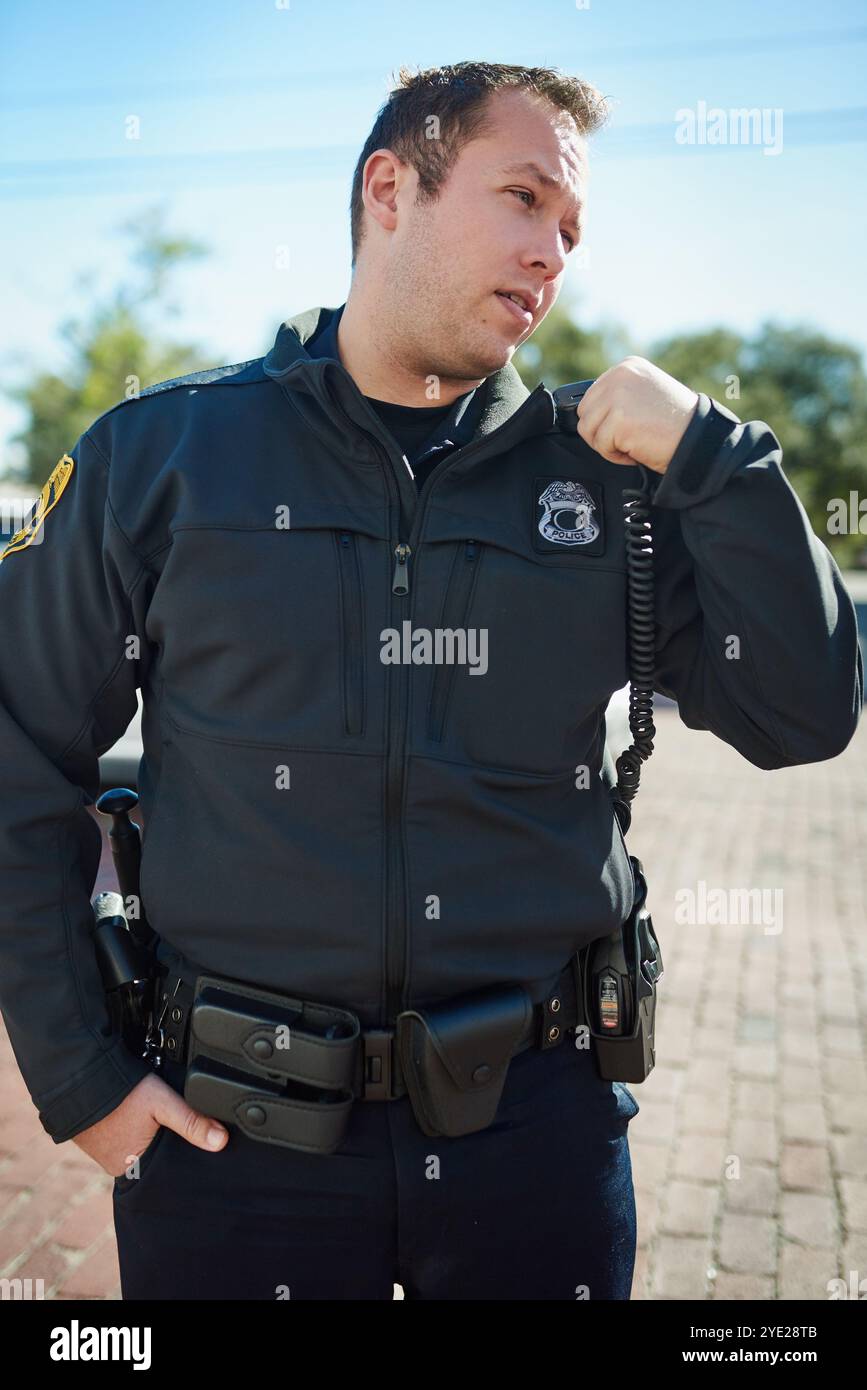 Police officer speaking police radio hi-res stock photography and ...