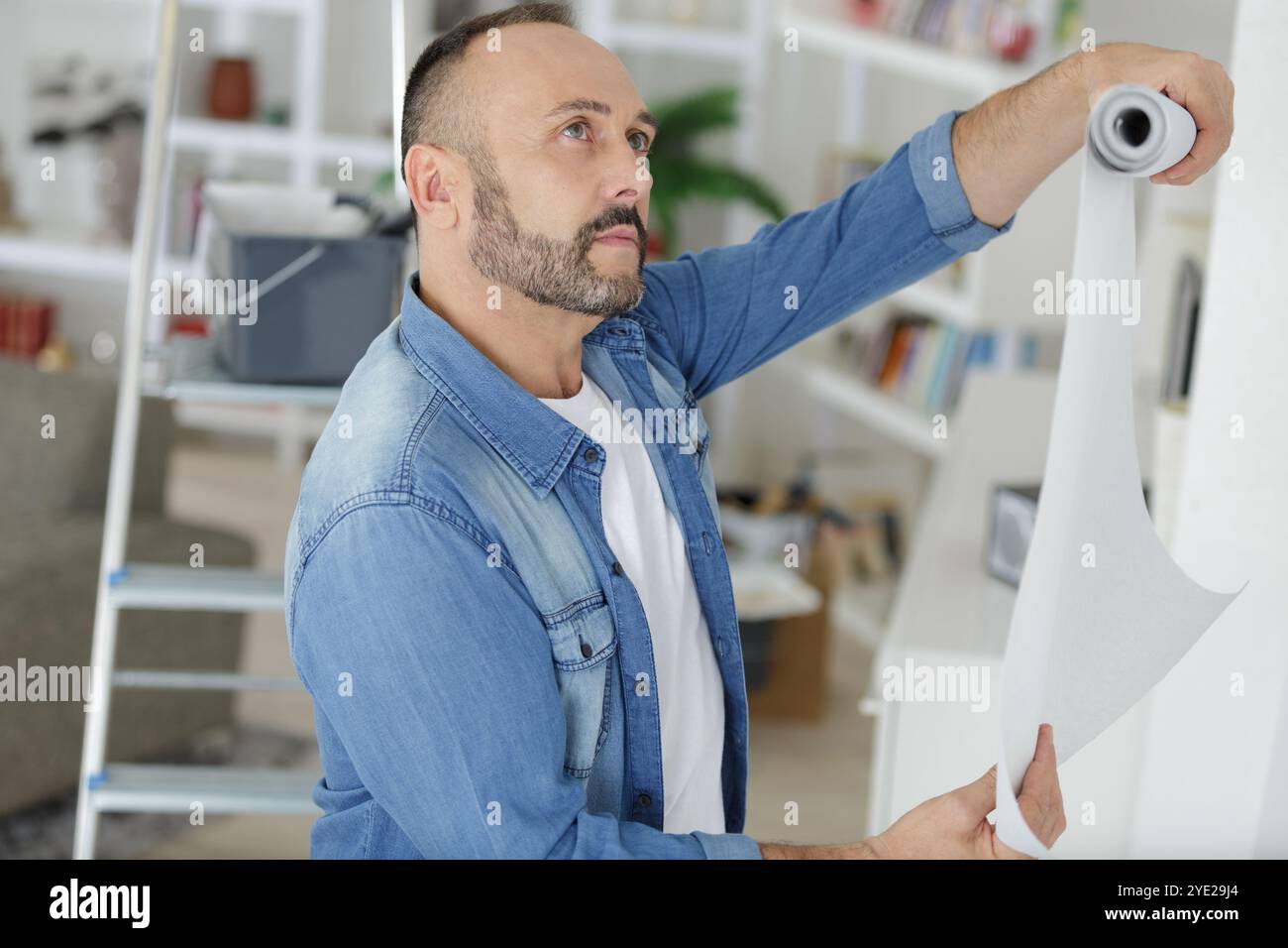 Painter man checking roller hi-res stock photography and images - Alamy